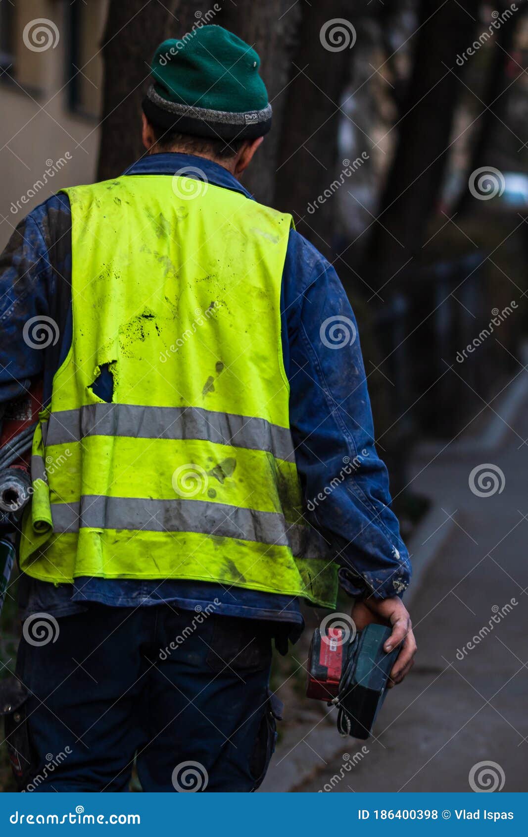 Back View of Construction Worker Wearing Reflective Vest Preparing for ...