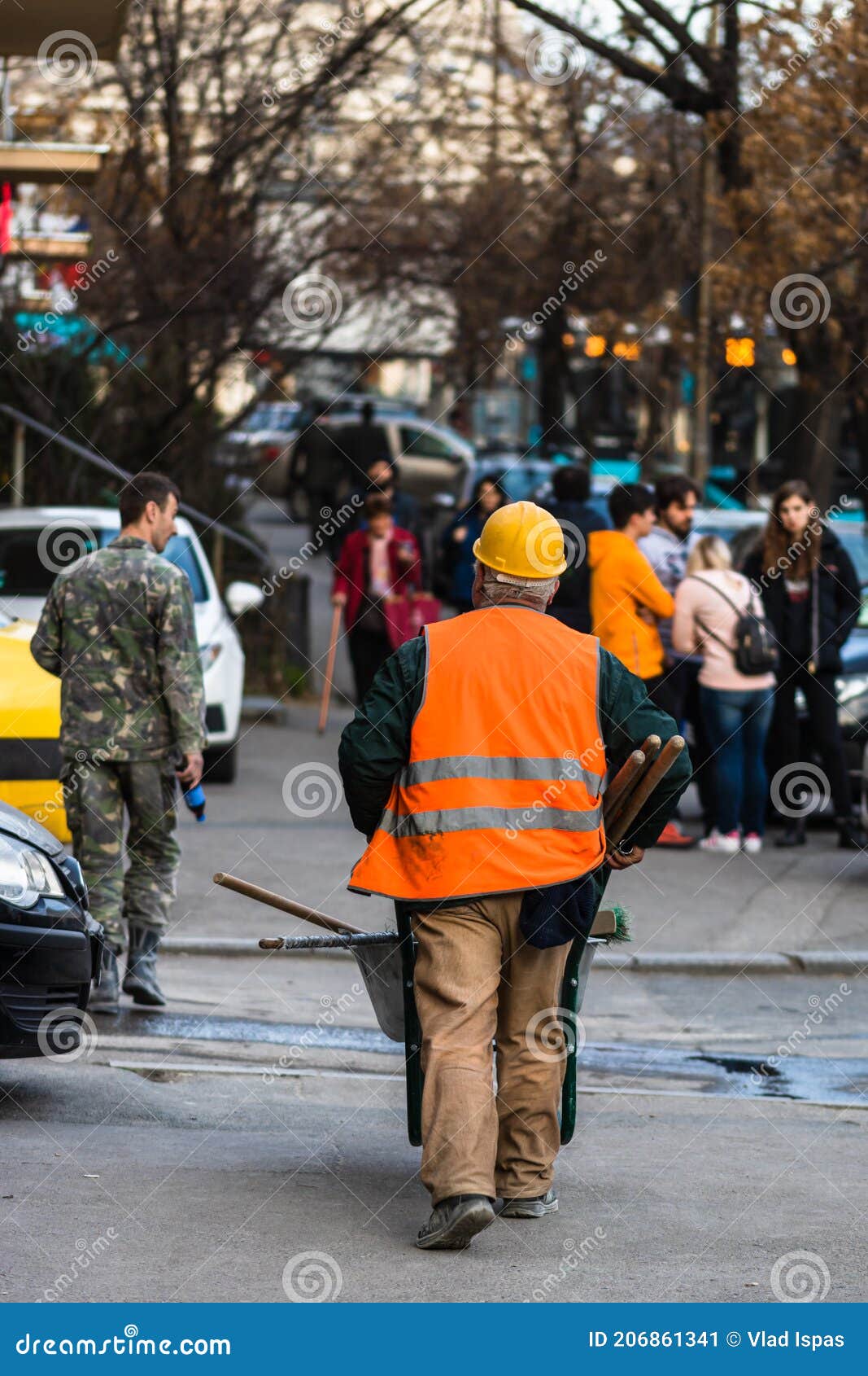 Back View of Construction Worker Wearing Reflective Vest Preparing for ...