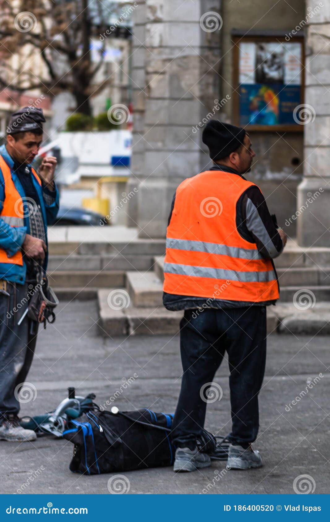 Back View of Construction Workers Wearing Reflective Vest Preparing for ...