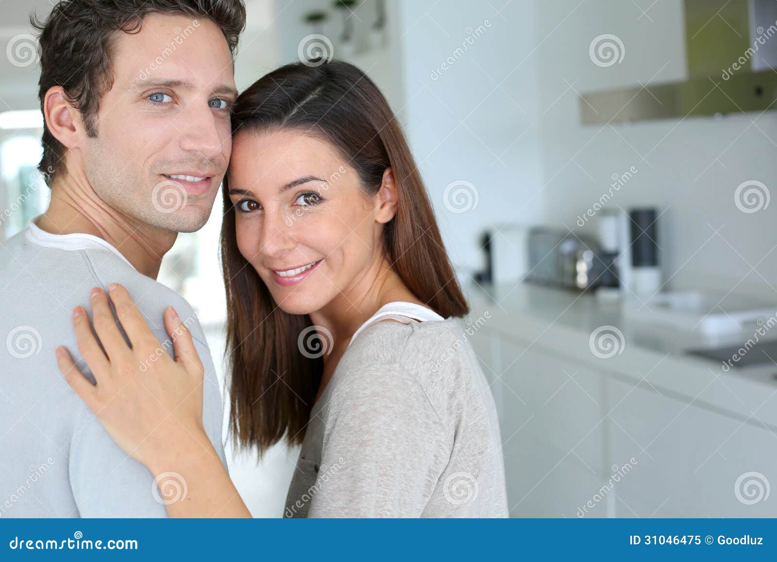 Back View of Couple at Home Looking at Camera Stock Image - Image of ...