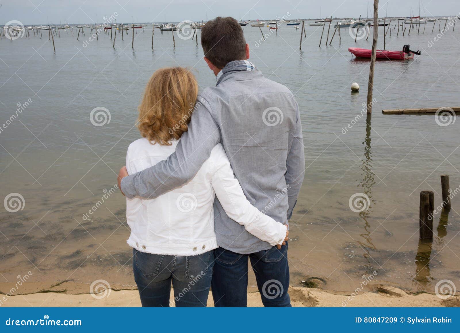Back View of a Couple Hugging and Watching the Sea Stock Image - Image ...