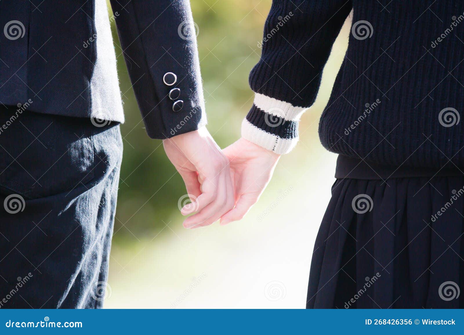 Back View of a Couple in Uniforms Holding Hands Stock Photo - Image of ...