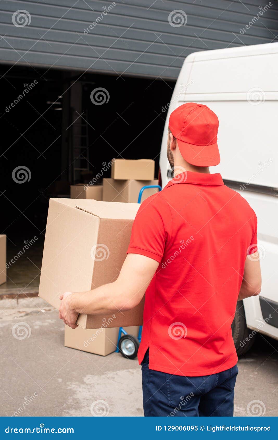 Back view of delivery man stock image. Image of delivering - 129006095