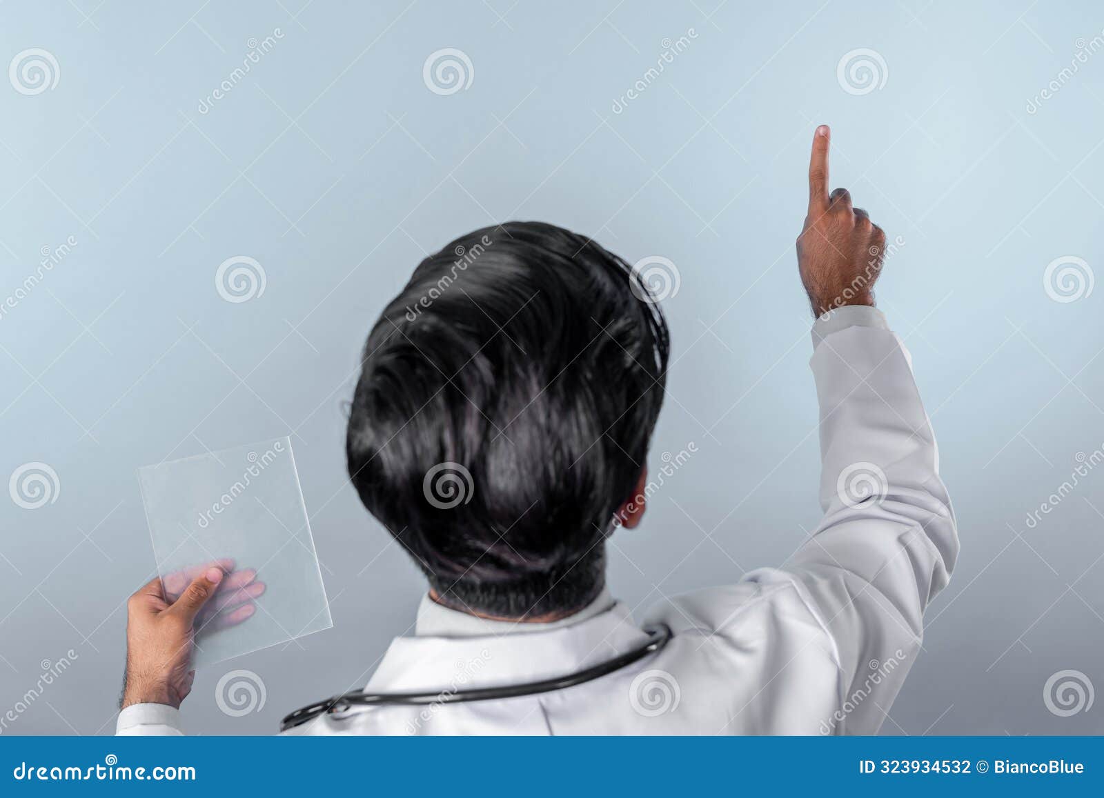 Back View of Doctor Pointing at Medical Data by Using VR Goggles ...