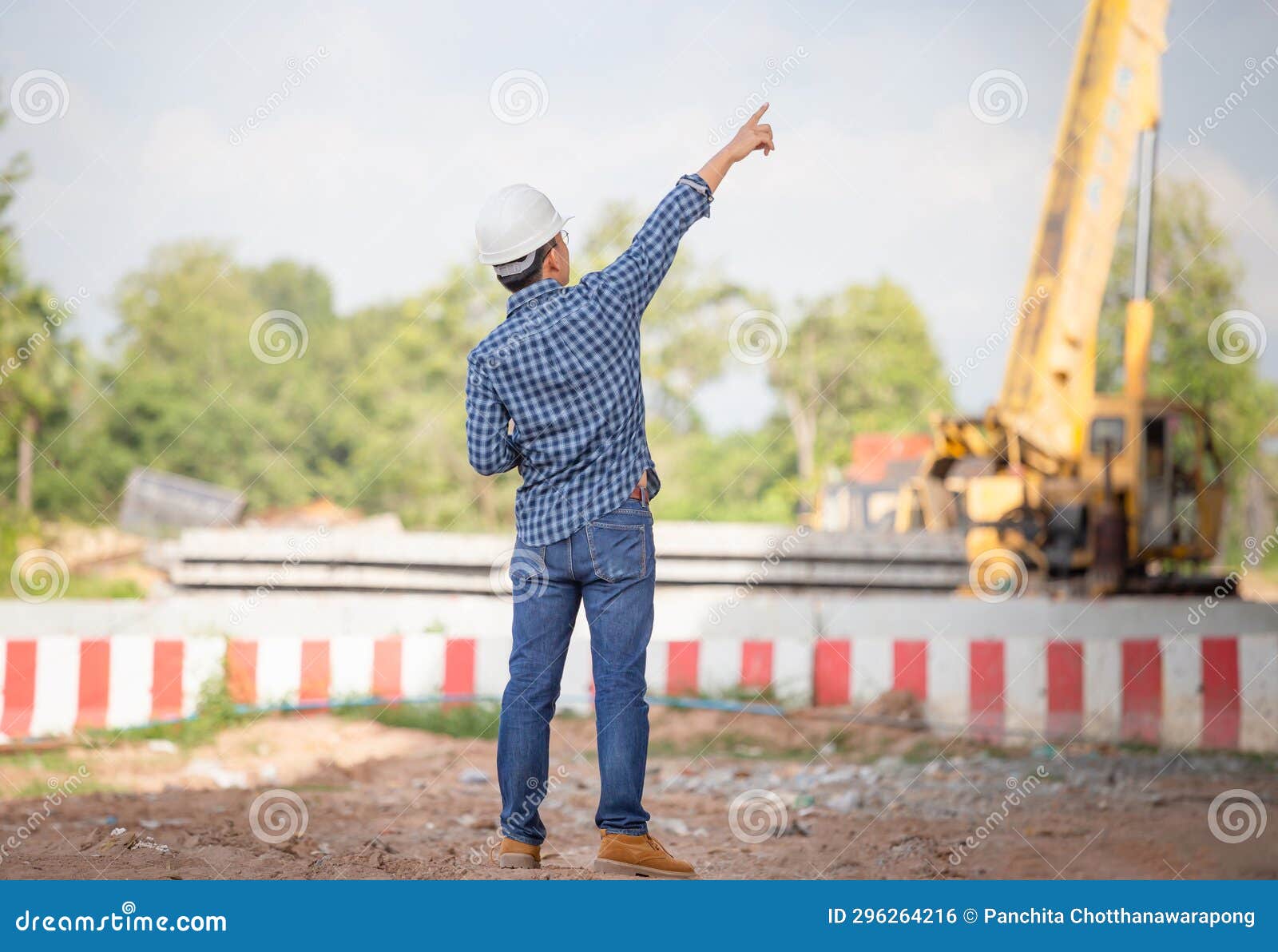 Back View of Engineer Checking Project at the Building Site, Foreman in ...