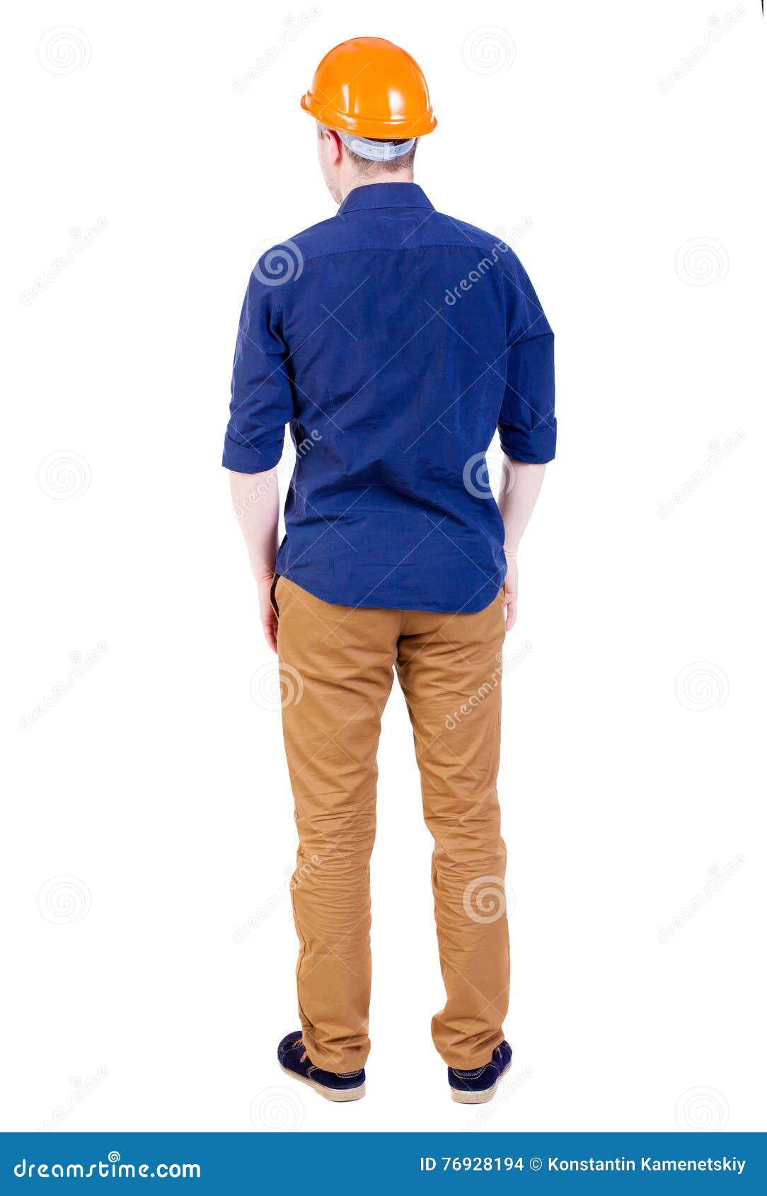 Back View of an Engineer in the Construction Helmet Stands. Stock Photo ...