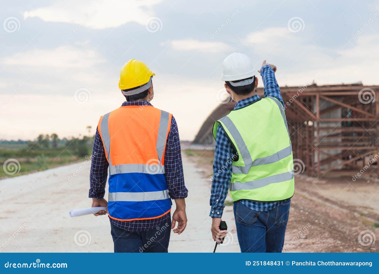 Back View of Engineer and Foreman Worker Checking Project at Building ...