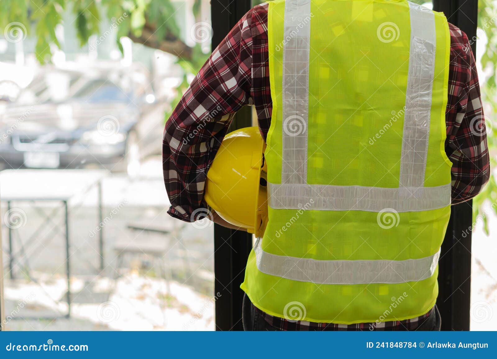 Back View of Engineer Holding Yellow Hat Concept in Construction Work ...