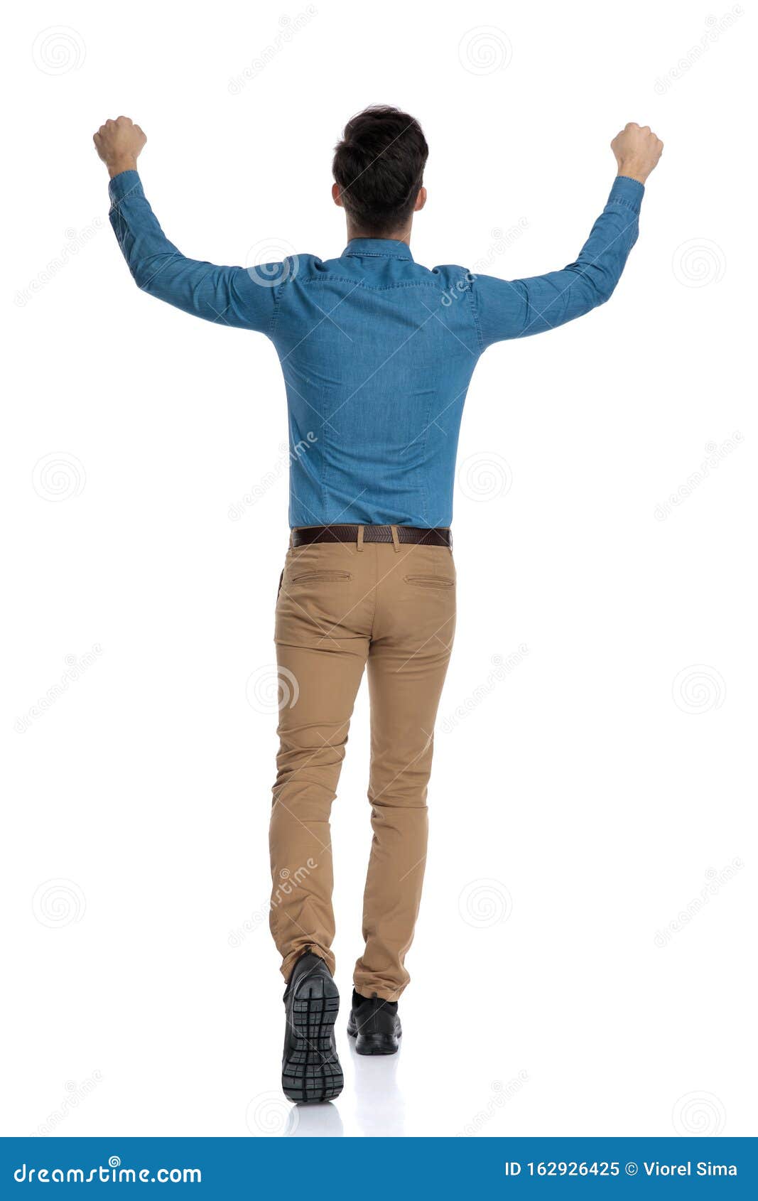 Back View of Excited Young Man Walking with Arms in the Air Stock Image ... Back View of Excited Young Man Walking with Arms in the Air Stock Image ...