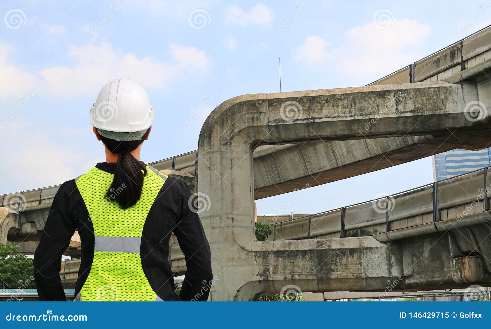 Back View of Female Construction Worker Against Expressway Background ...