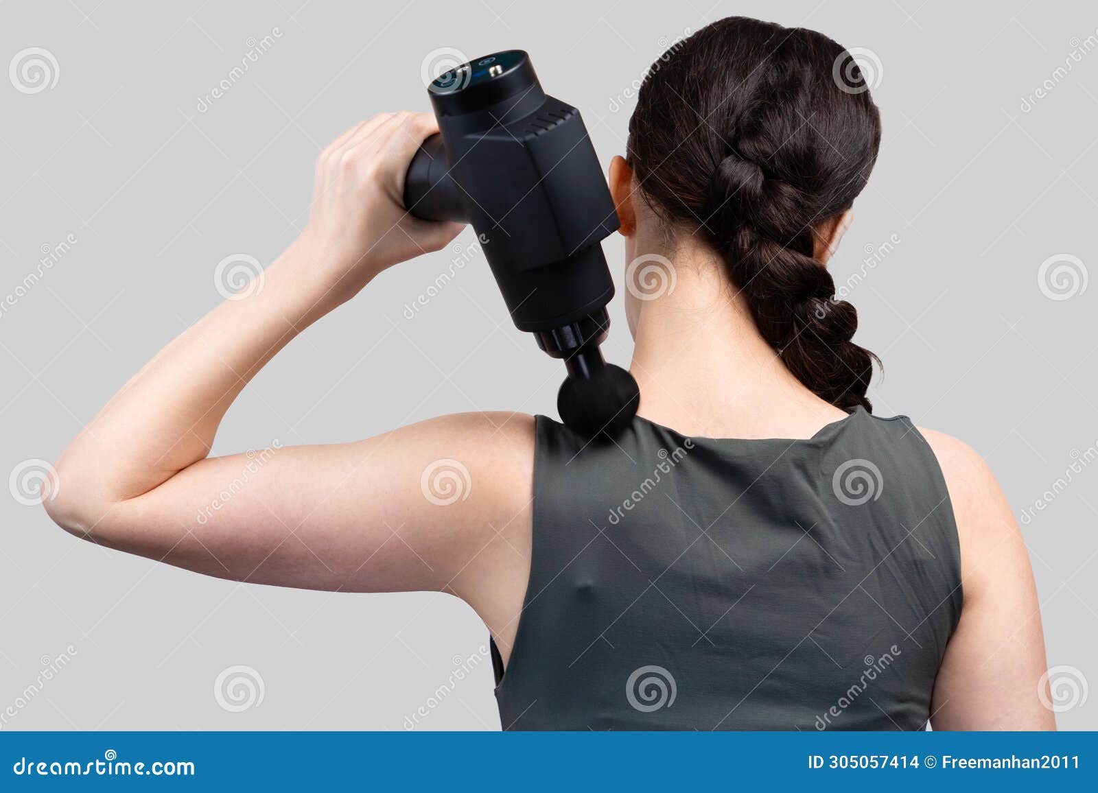 Back View Of Fit Woman Gives Herself Massage On Upper Arm With