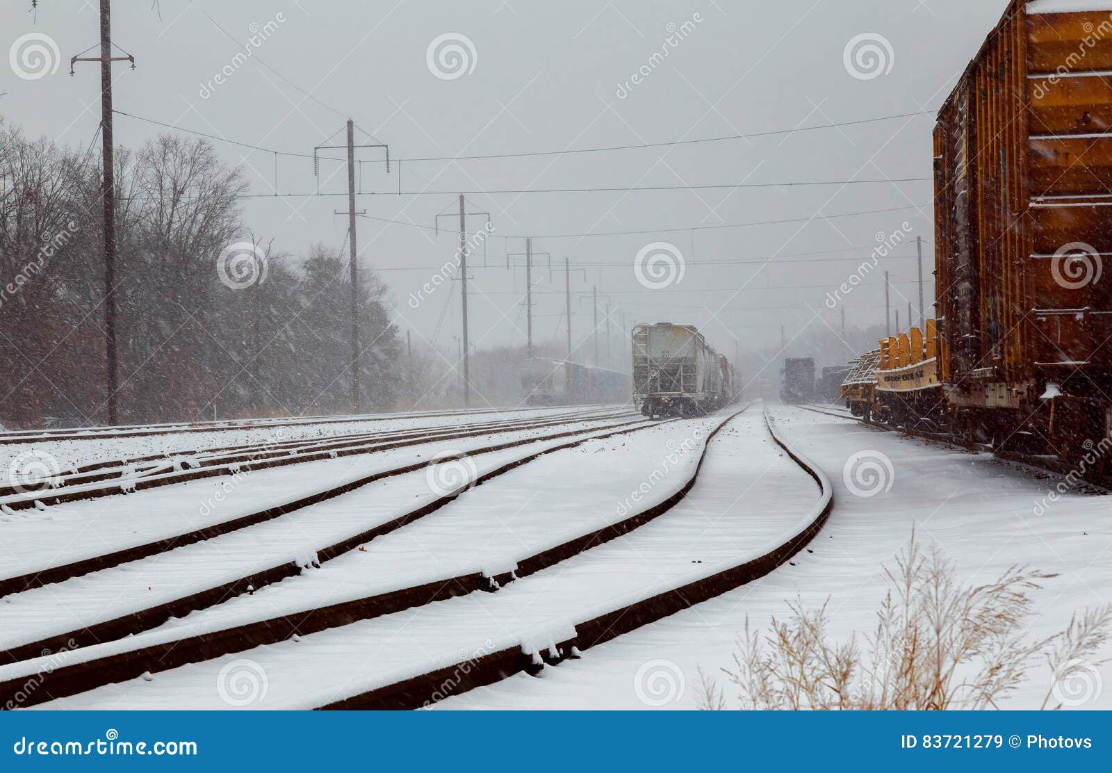 Back View of Freight Train Running on the Railway Tracks in Winter ...