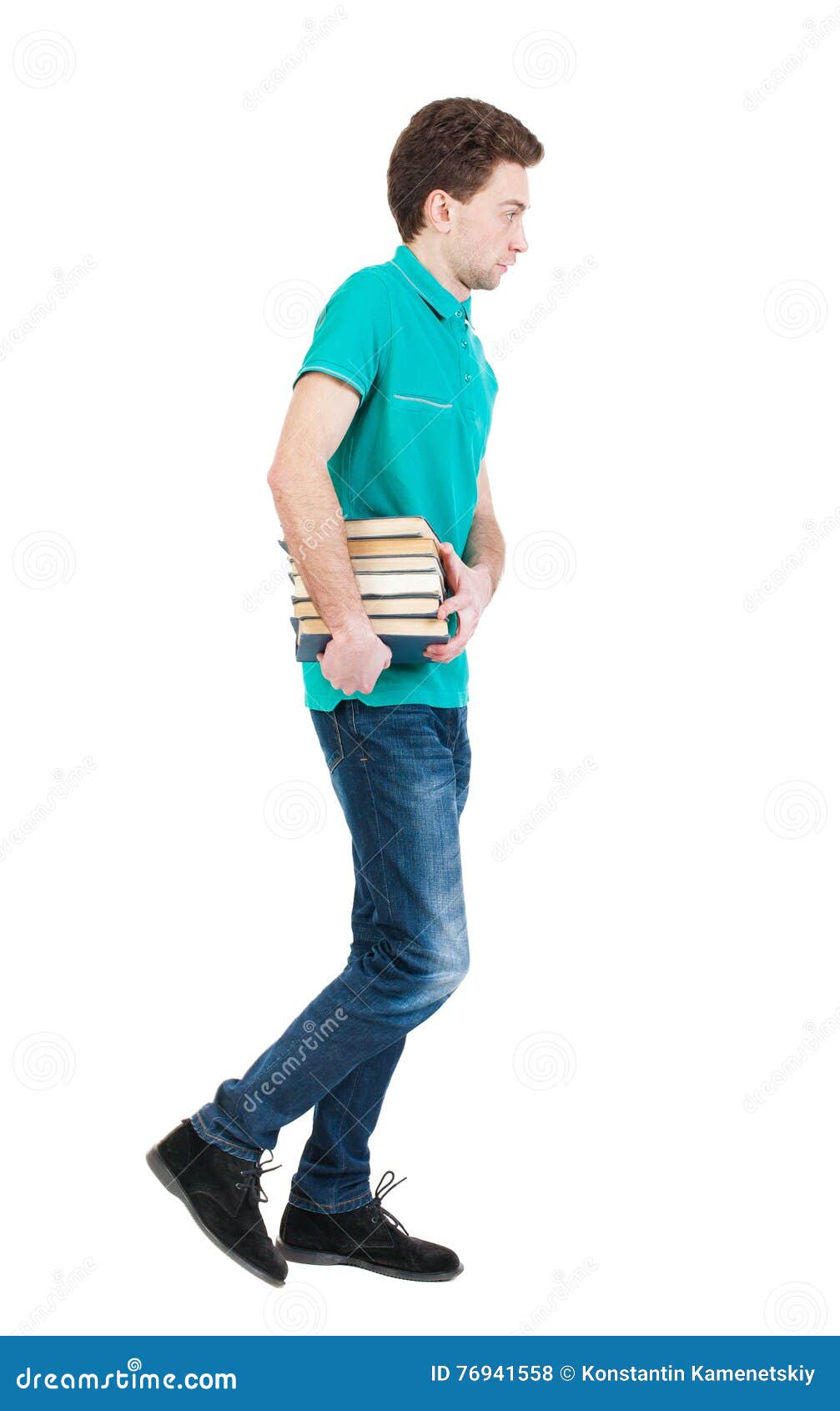 Back View of Going Handsome Man Carries a Stack of Books. Stock Photo ...