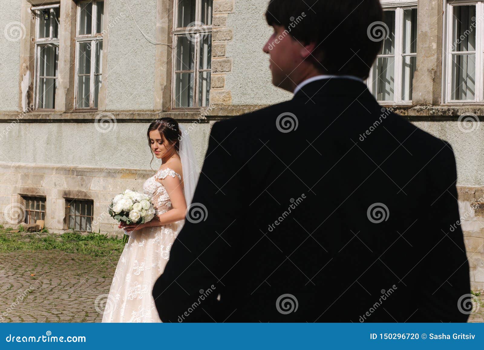 Back View of Groom Standing Back and Looking on His Bride Stock Photo ...