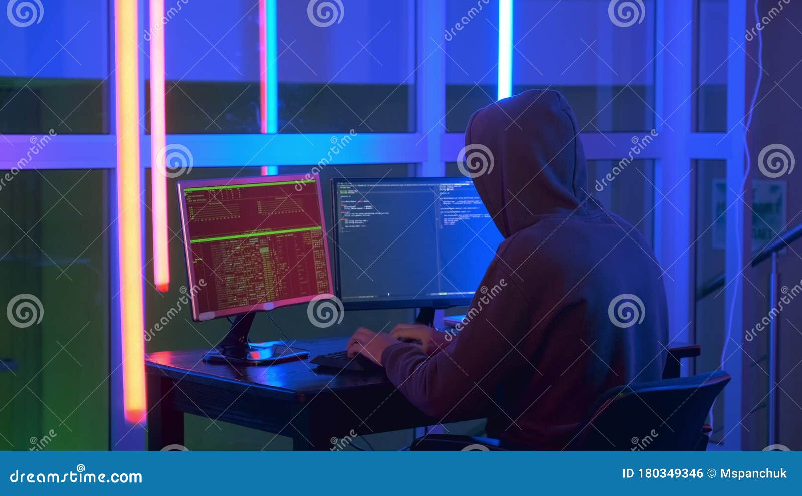 Back View of Hacker Dressed in a Dark Close Working on Computer Stock ...