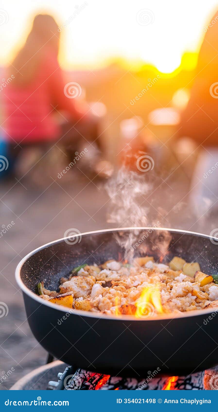 Back View of Hikers Setting Up Camp and Cooking Over an Open Fire Near ...