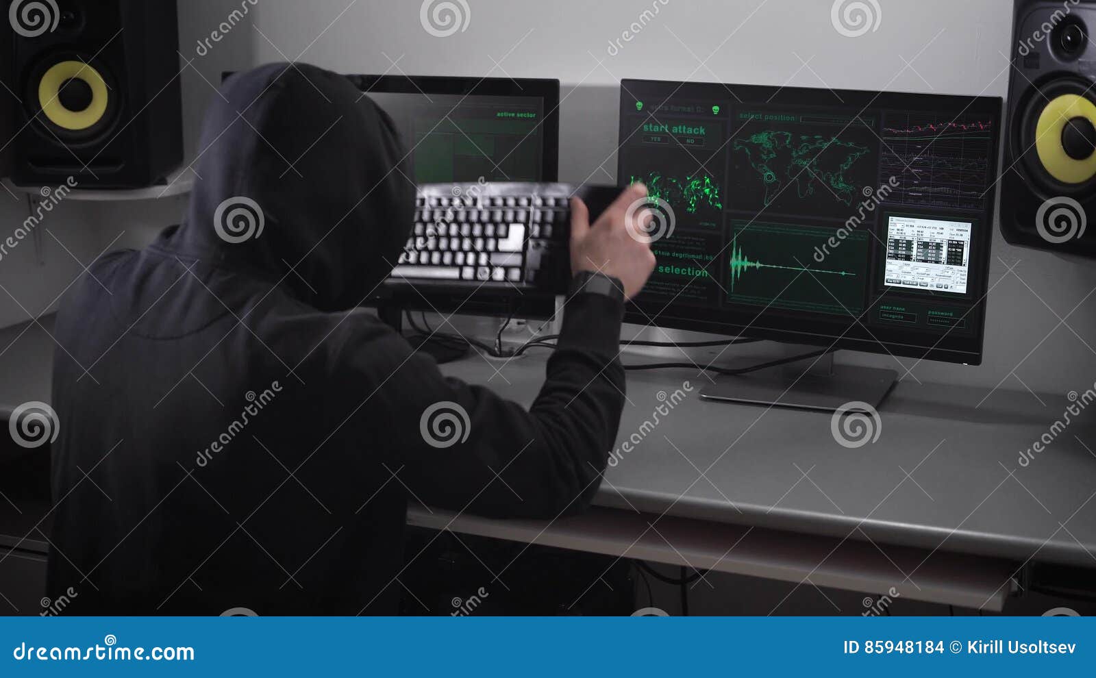 Back View of a Hooded Angry Hacker in Black Making Cyber Attack on Bank ...