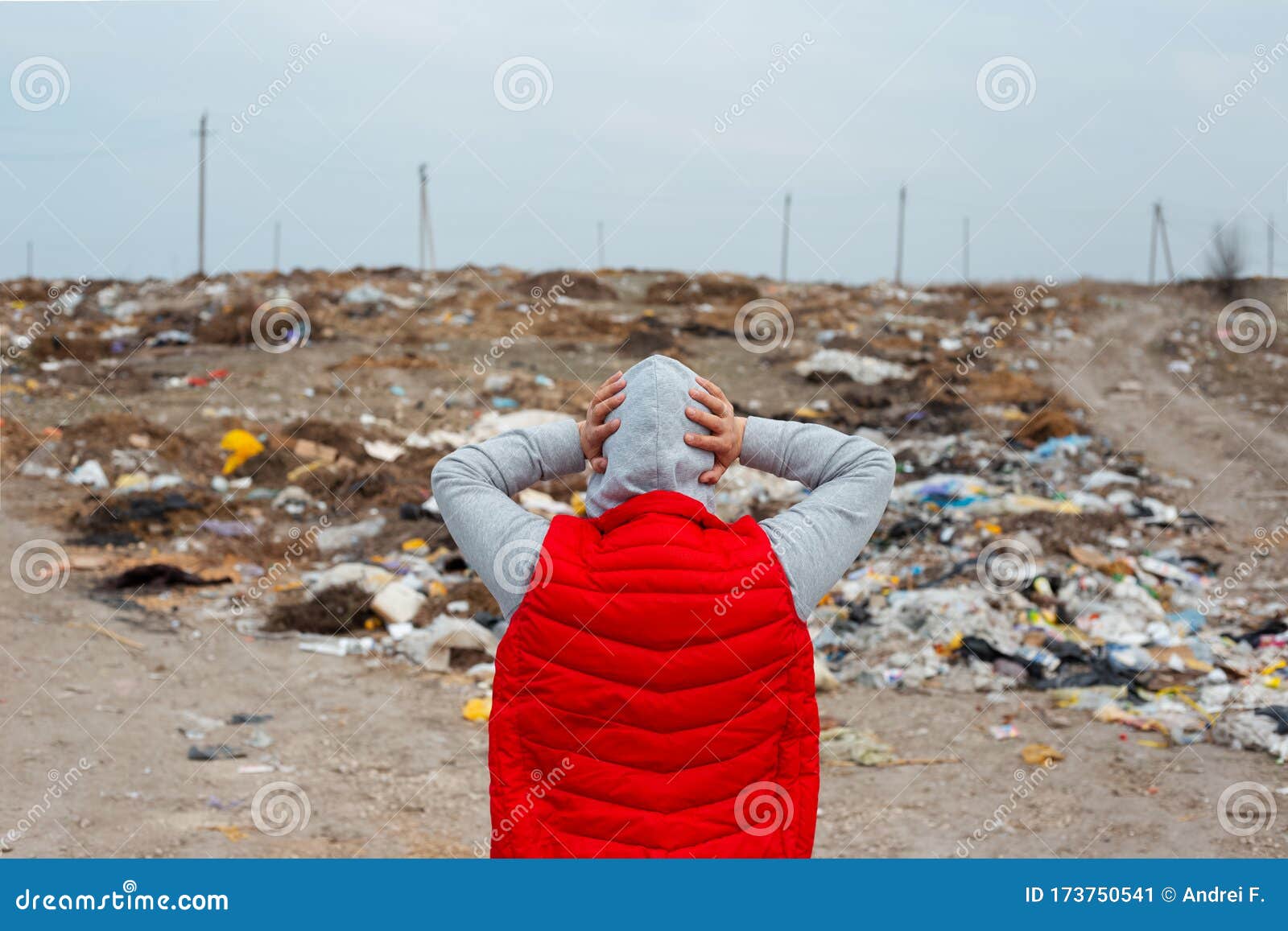 Back View of Human with Hands on Head Looking on a Lot of Garbage ...