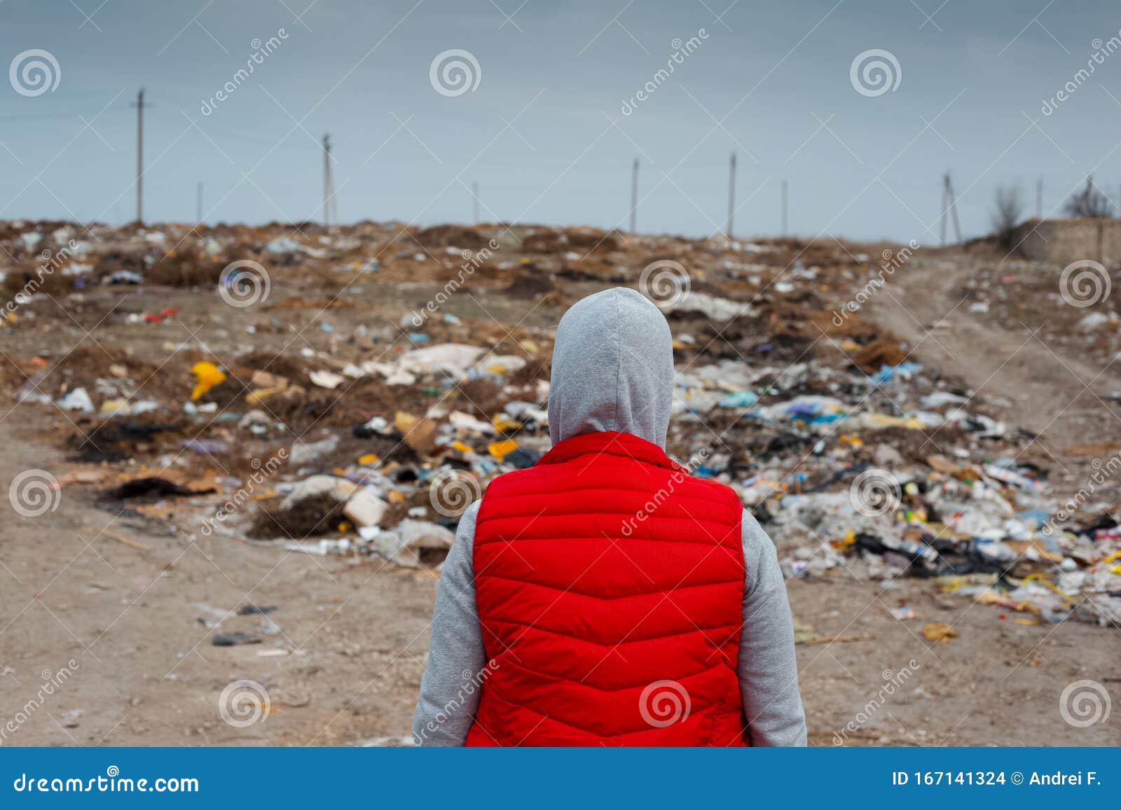 Back View of Human in Red Jacket, Looking on a Big Garbage Field. Stock ...