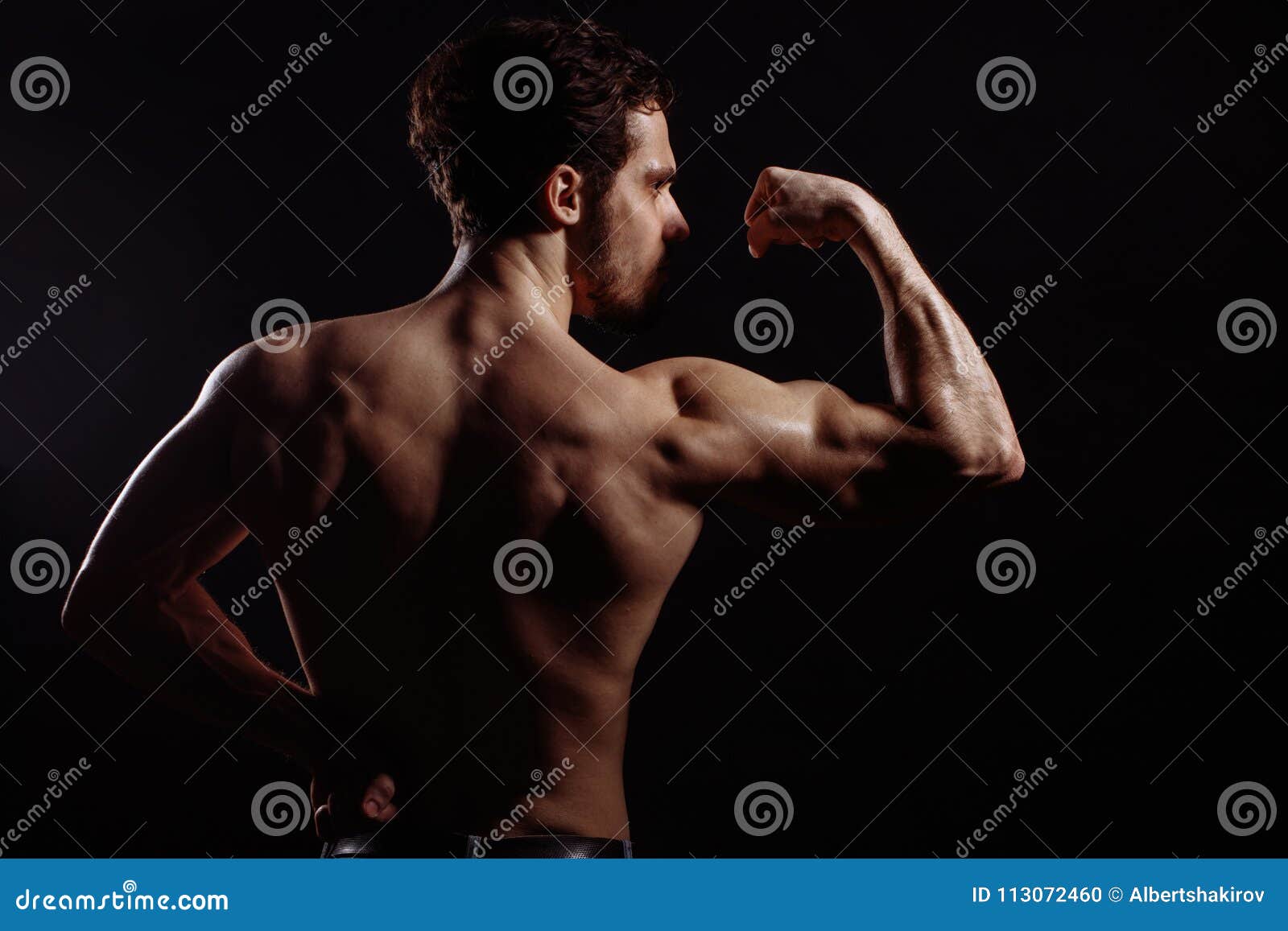 Back View Image of Male Controlong and Developing Musculature. Stock ...