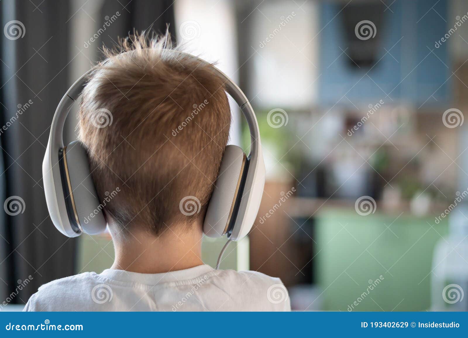 Back View of a Little Boy Wearing Headphones. Stock Image - Image of ...