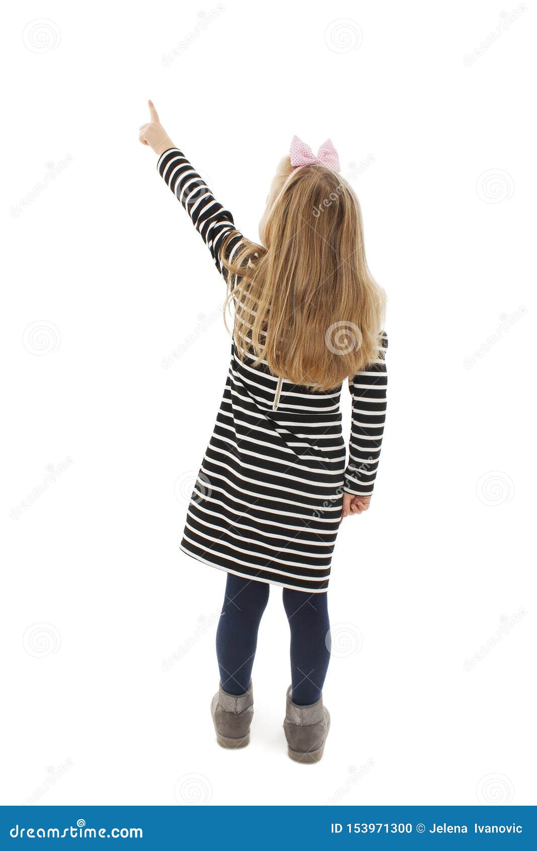 Back View of Little Girl Points at Wall. Rear View Stock Photo - Image ...
