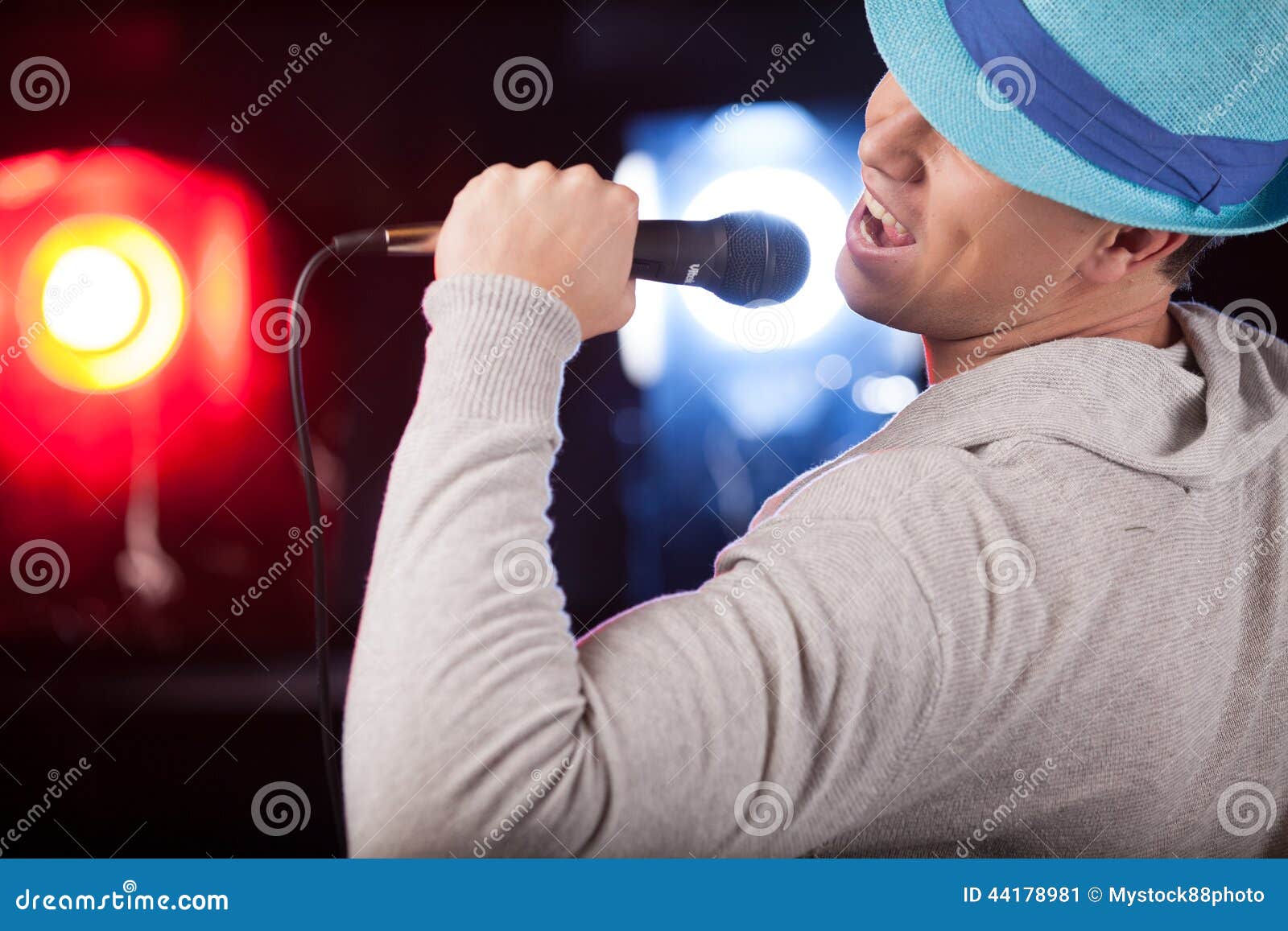 Back View of Male Singer Wearing Blue Hat. Stock Image - Image of ...