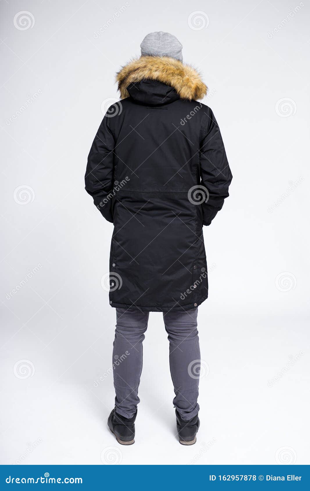 Back View of Man in Black Warm Winter Jacket Over Gray Background Stock ...
