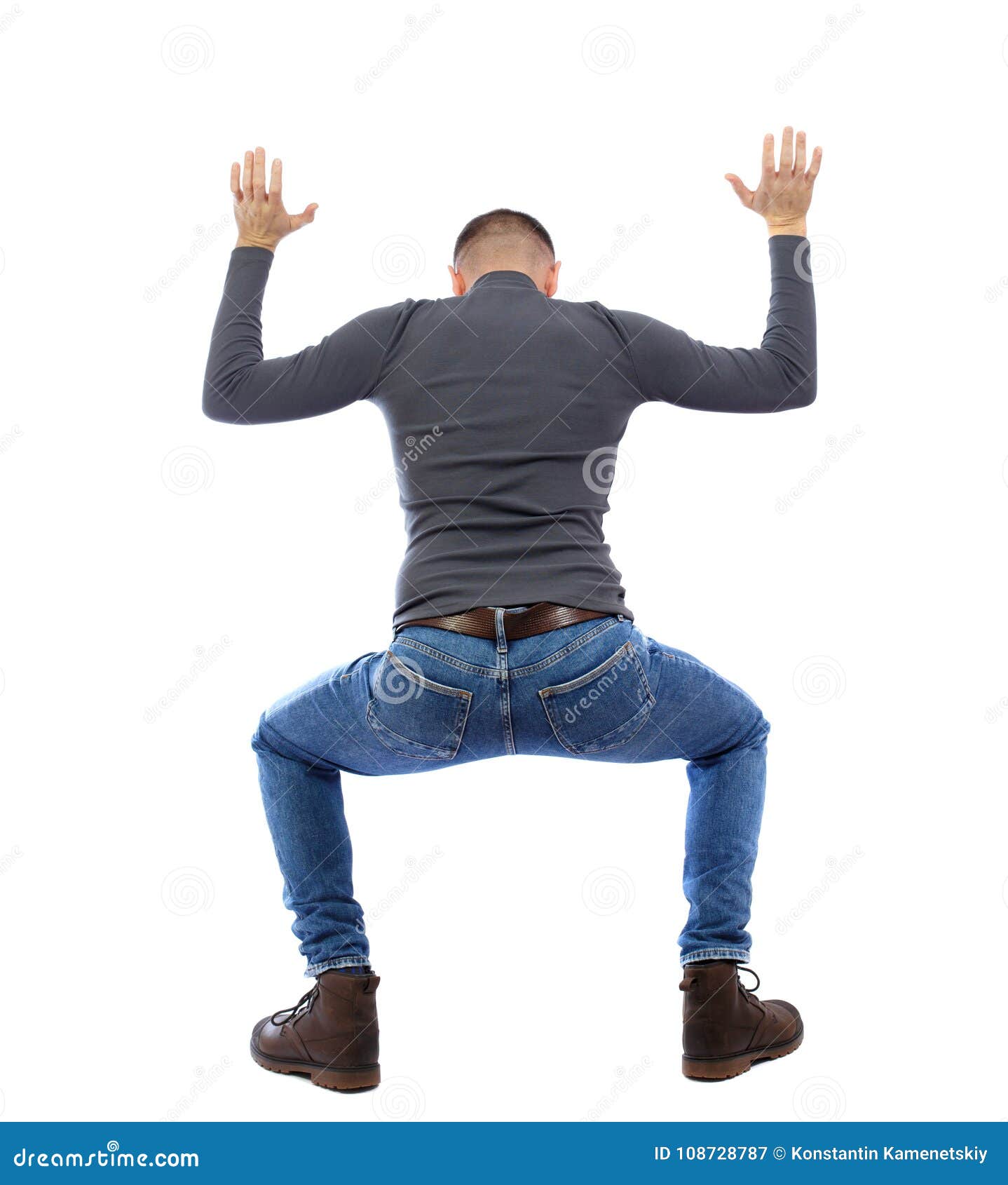 Back View. Man Protects Hands from What is Falling from Above Stock ...