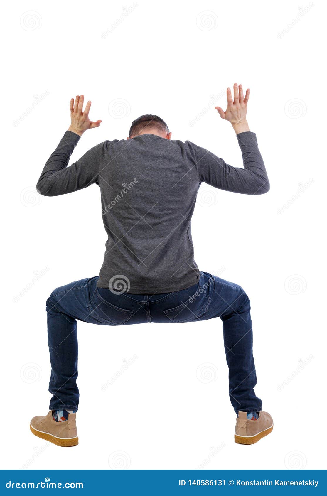 Back View. Man Protects Hands from What is Falling from Above Stock ...