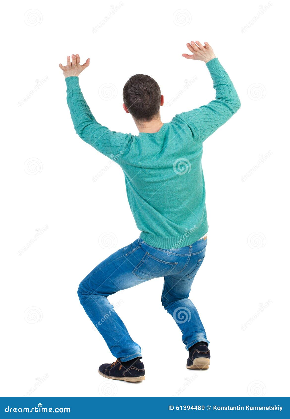 Back View. Man Protects Hands from What is Falling from Above Stock ...