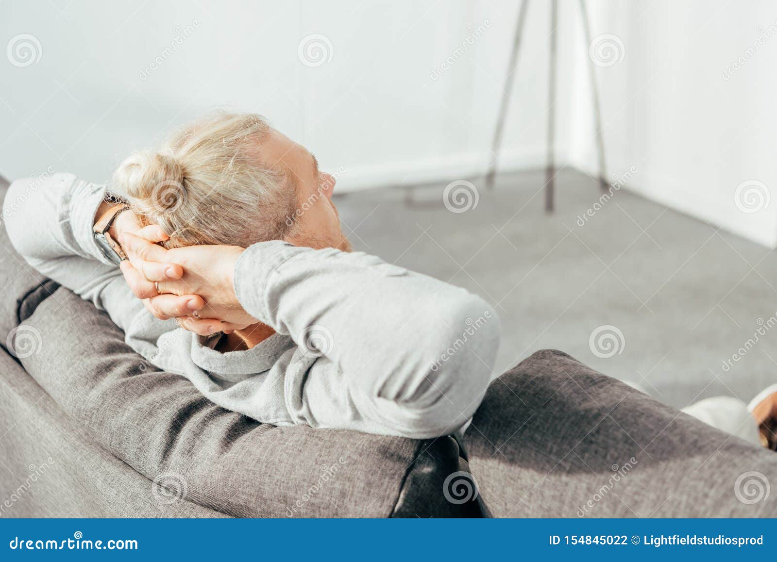 Back View of Man Resting with Hands Behind Head Stock Photo - Image of ...
