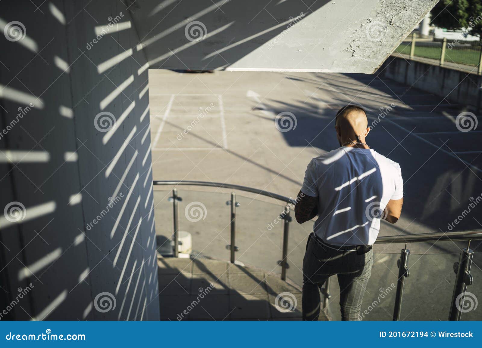 Back View of a Man with Shadows Falling on His Back Stock Photo - Image ...