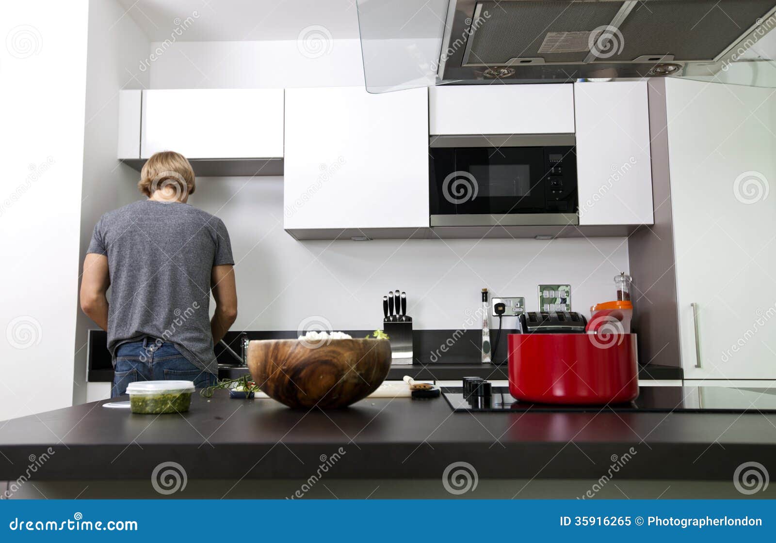 Back View of Man Standing in Kitchen Stock Image - Image of standing ...