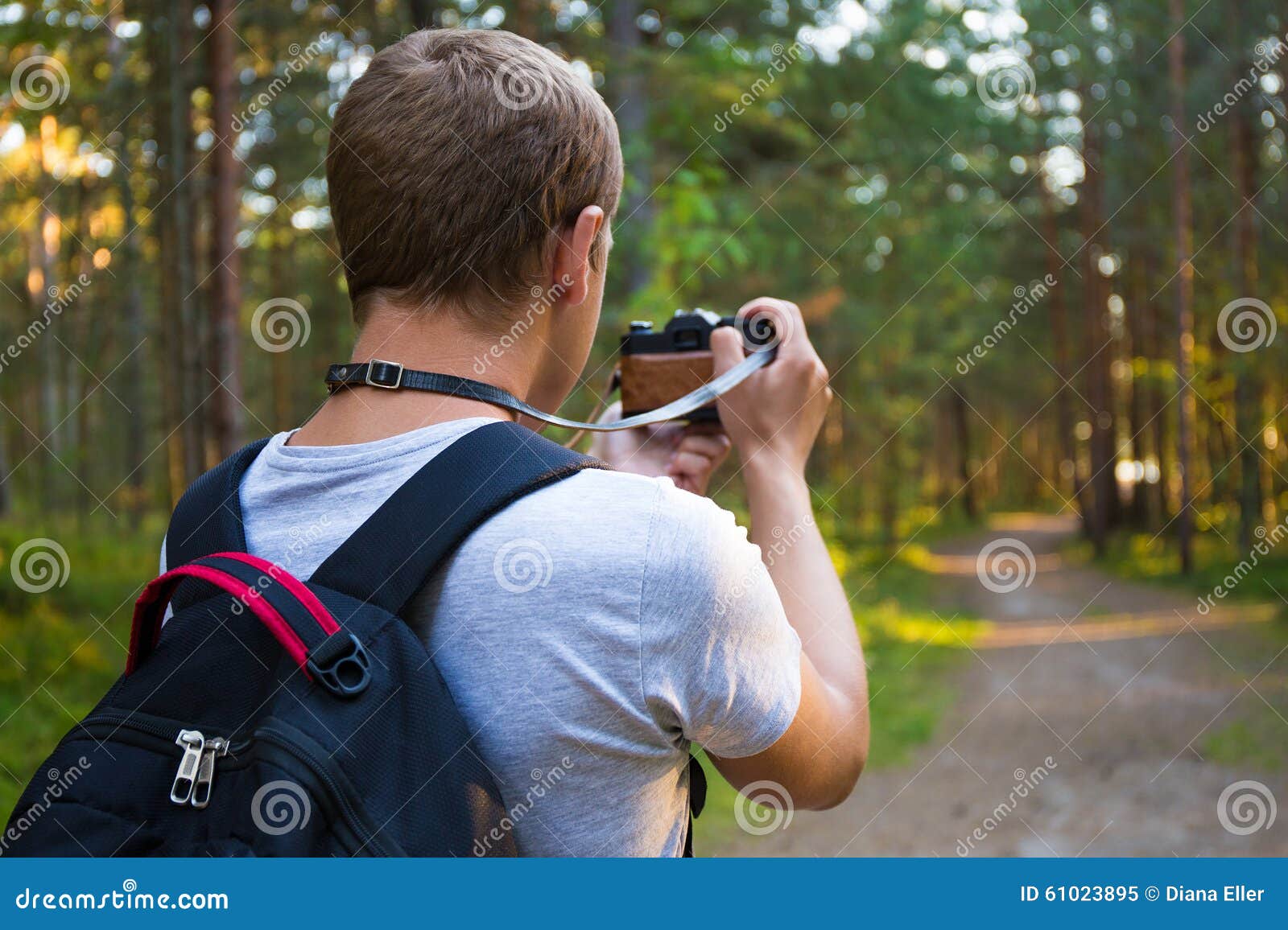Back View Of Man Taking A Photo With Retro Camera Stock Image - Image ...