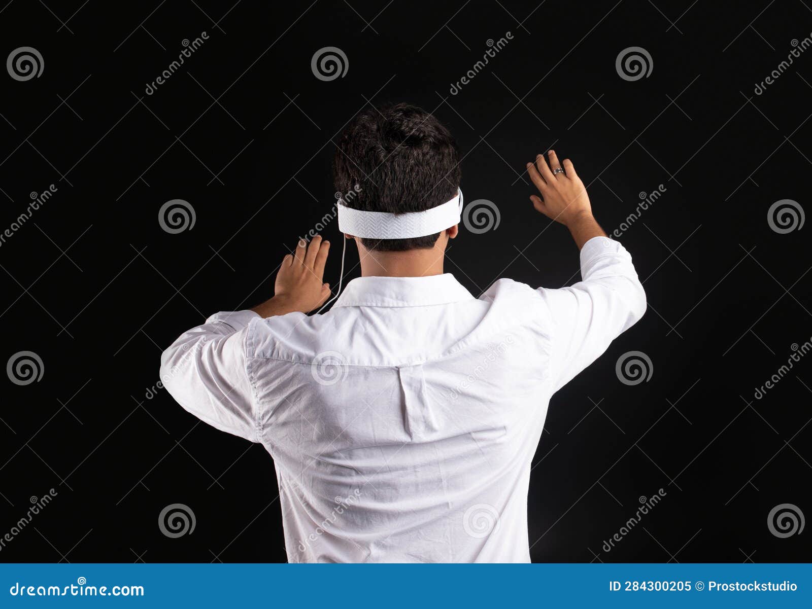 Back View of Man Touching Invisible Screen while Experiencing ...