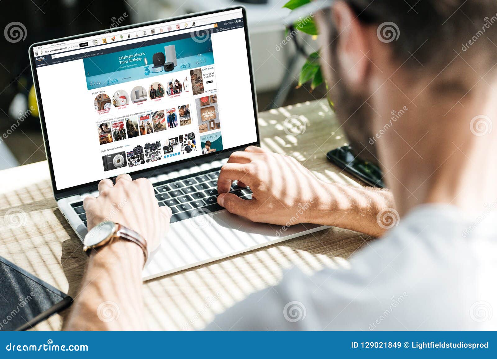 Back View of Man Using Laptop with Amazon Website Editorial Stock Image ...