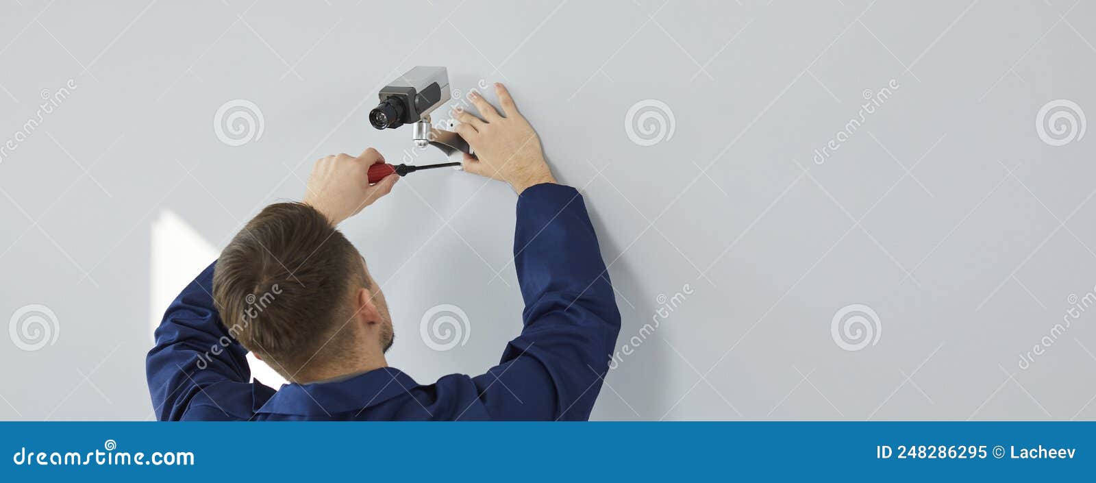Electrician Installing Modern Surveillance CCTV Camera on Wall Inside ...