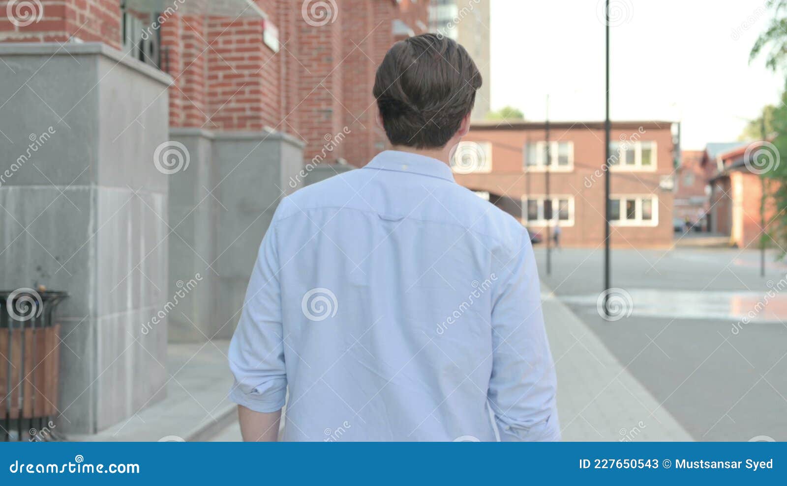 Back View of Man Walking in a Street Stock Video - Video of outdoor ...