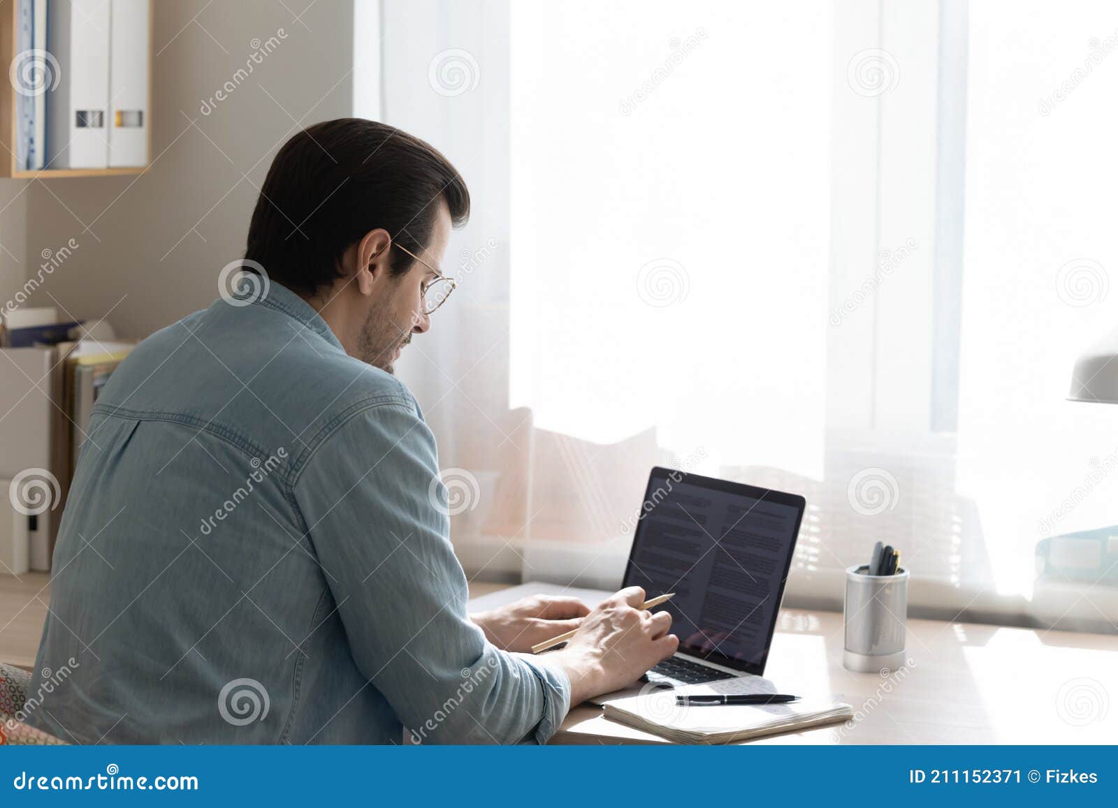 Back View of Man Work Online on Computer Stock Image - Image of read ...