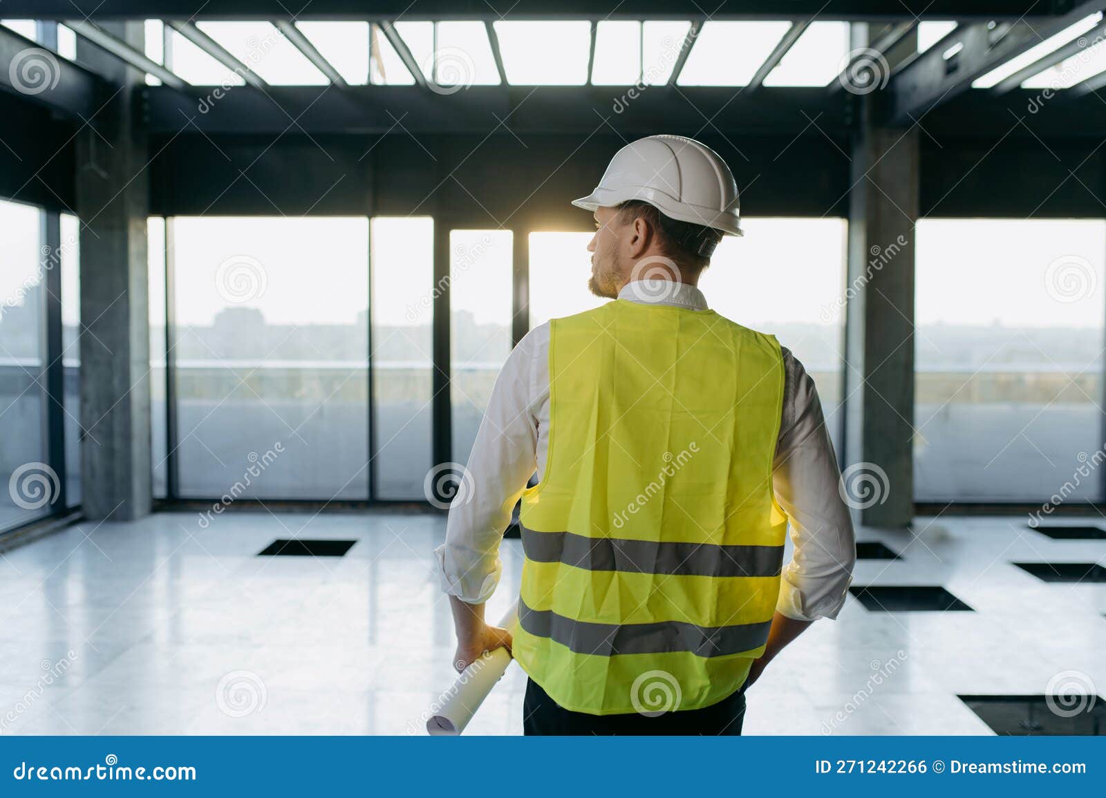 Back View of Man in Work Vest Standing on Territory Construction Area ...