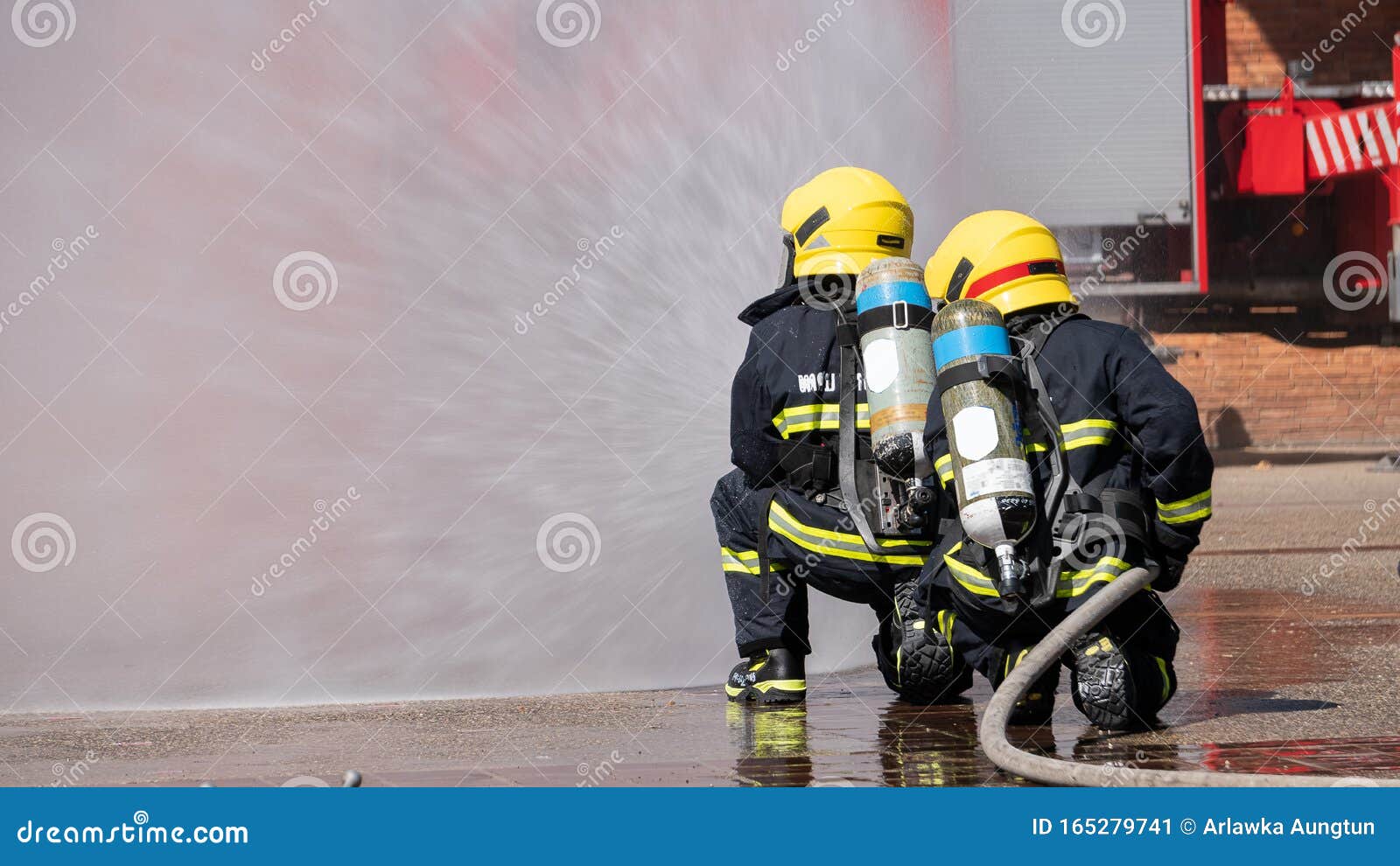 The Back View of Many Firefighters is Practicing Using Fire Stock Image ...
