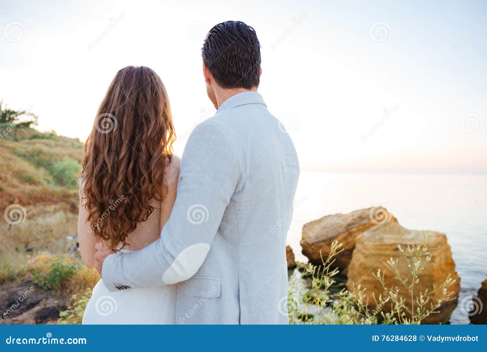Back View of a Married Couple Hugging on the Beach Stock Photo - Image ...