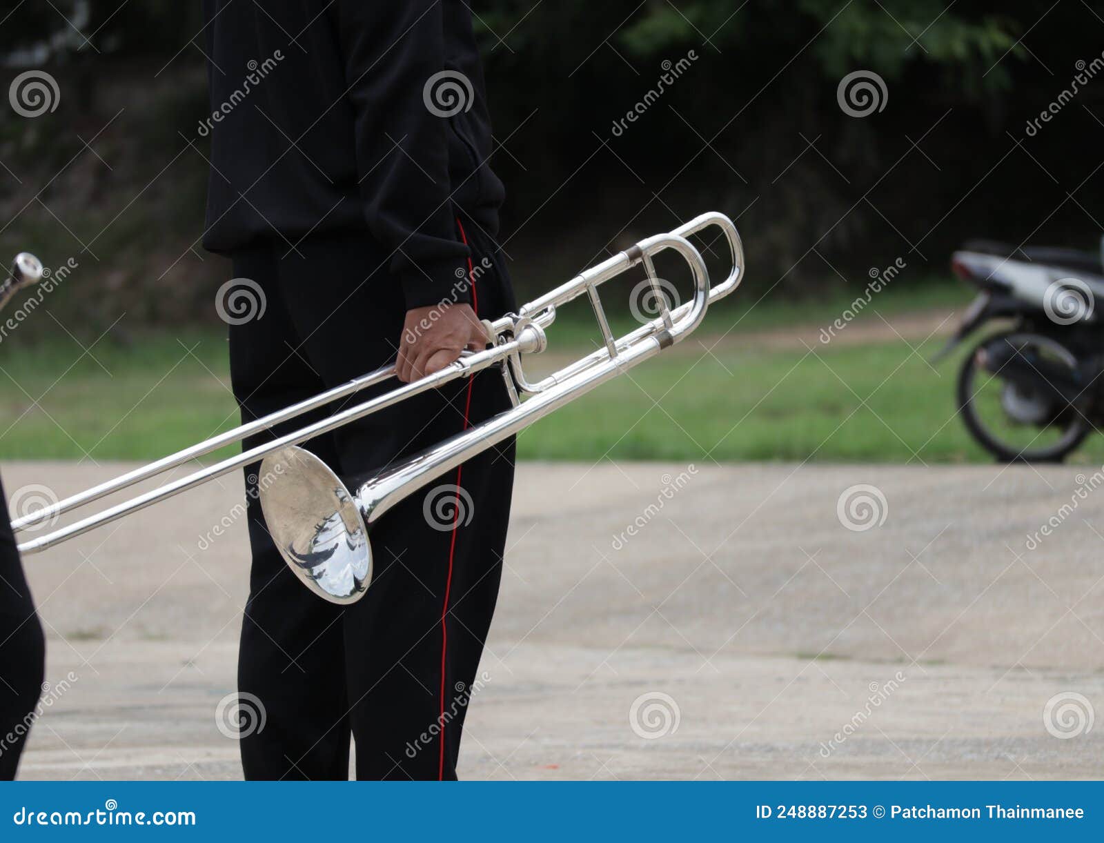Back View of a Musician Holding a Trombone Instrument Outdoors Stock ...