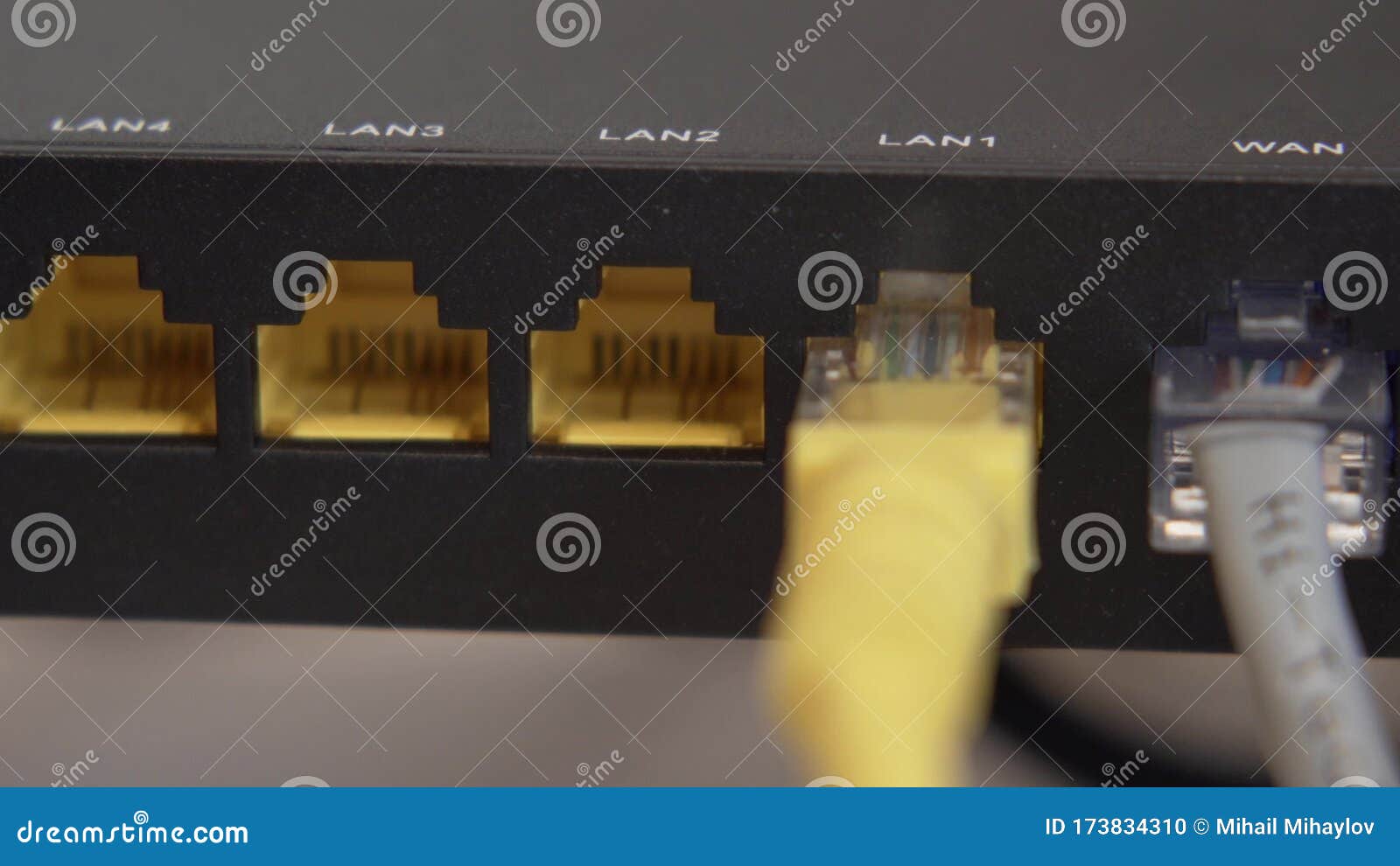 Yellow Internet LAN Cable Connected with Router. Equipment, Technology ...