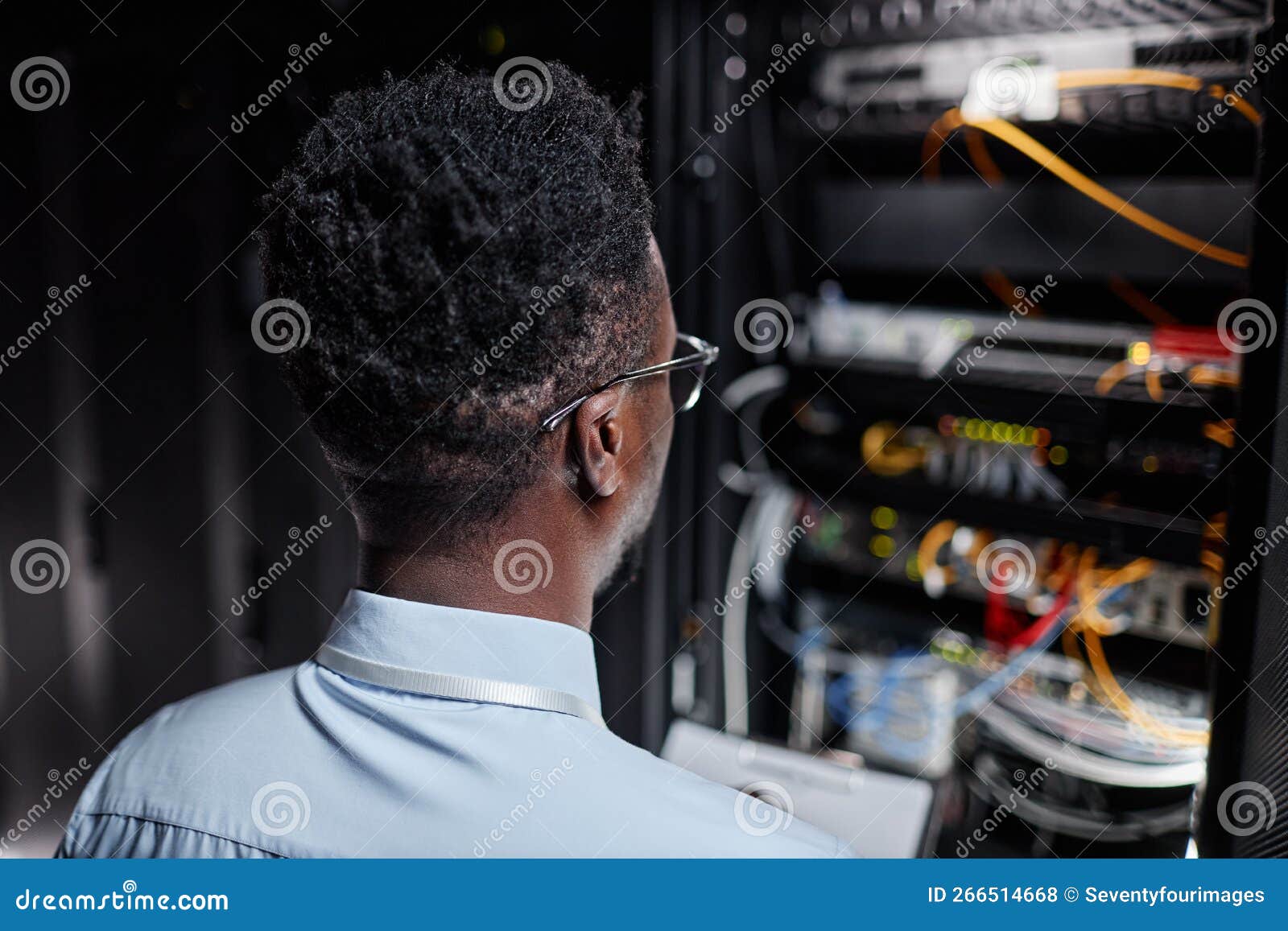 Back View Network Engineer Working with Server Cabinet in Data Center ...