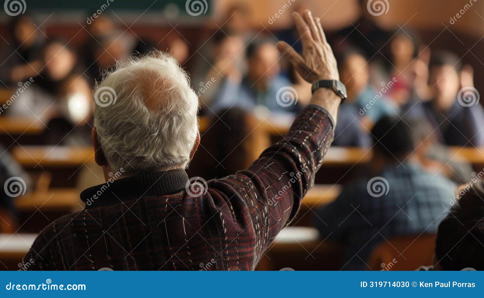 Back View of Older Student Raising His Hand To Answer Teacher S ...