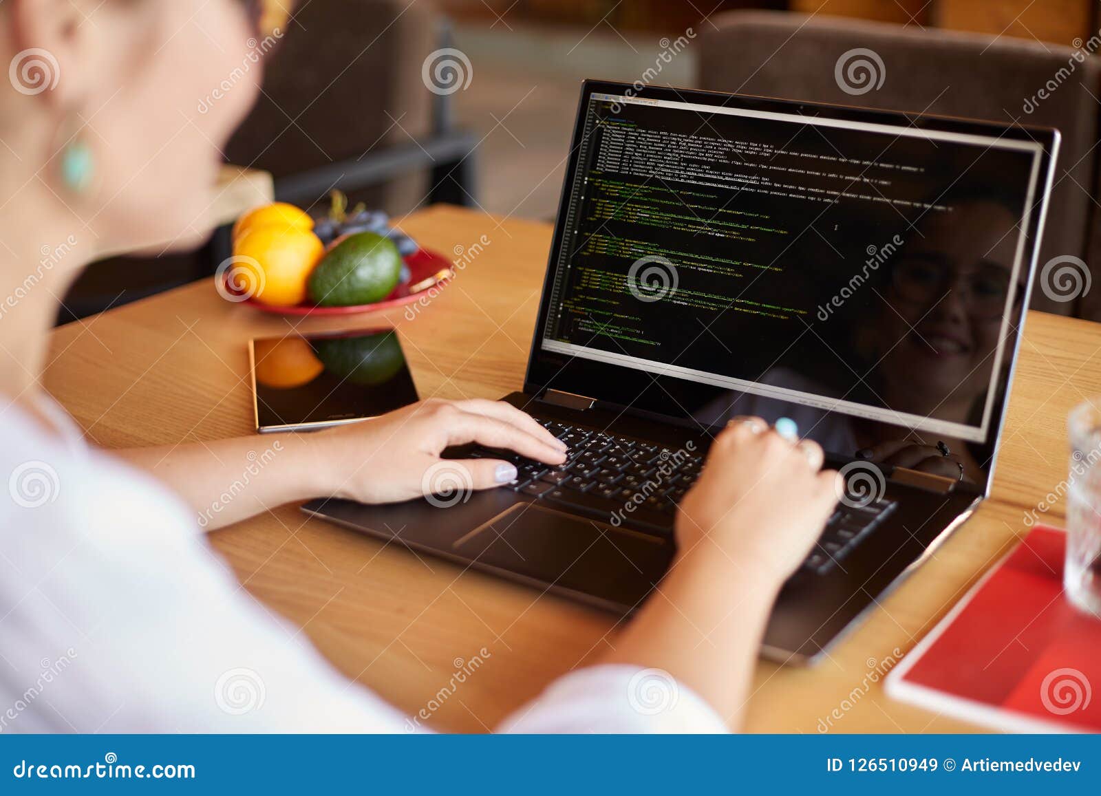 Back View Over the Shoulder Shot of Developer Programmer with Laptop ... Back View Over the Shoulder Shot of Developer Programmer with Laptop ...