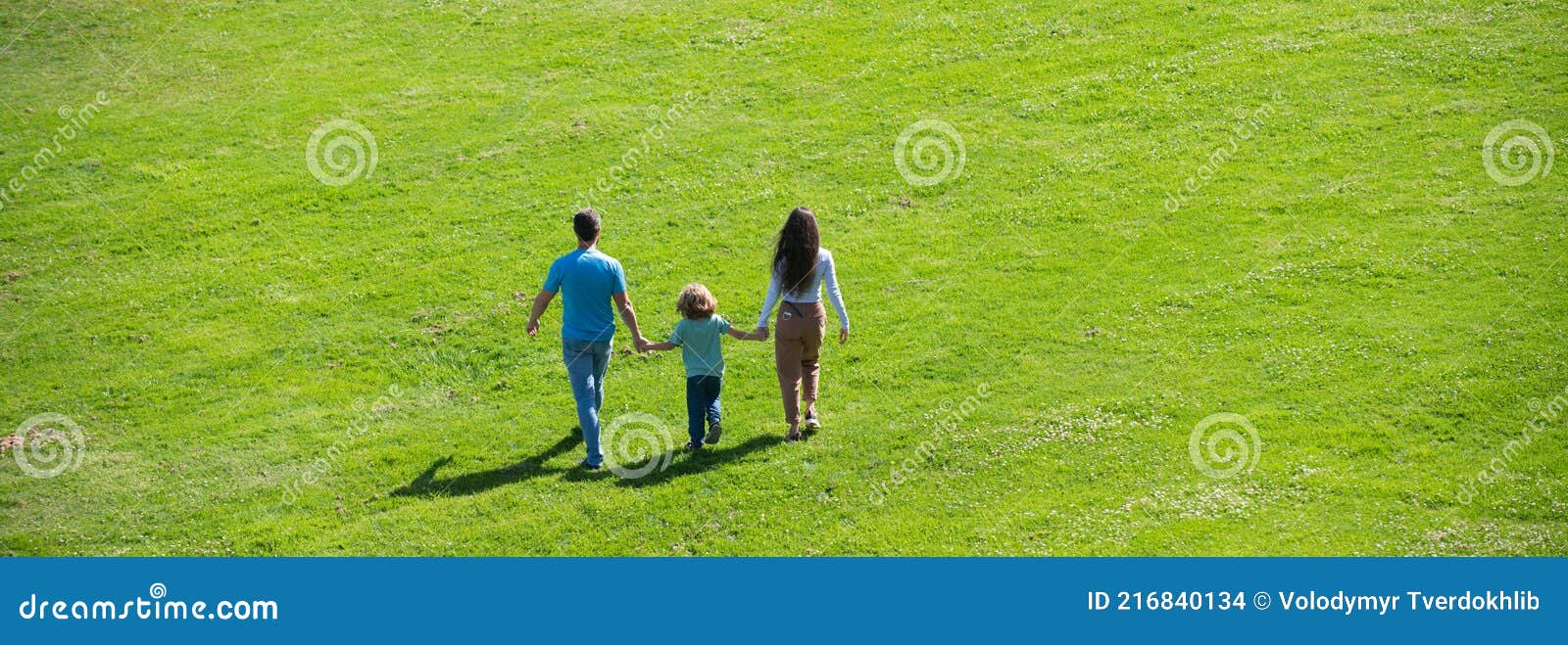 Back View of Parents Playing with Child Outside in Park. Banner ...