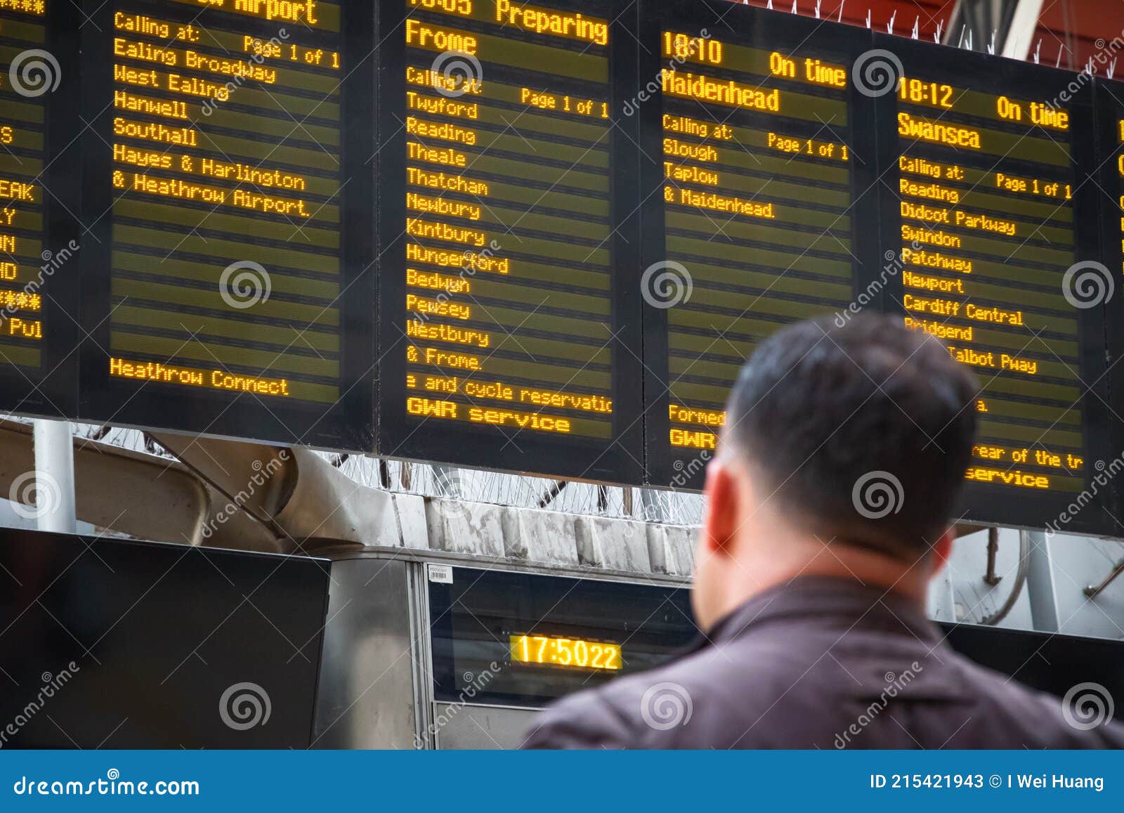 Back View of a Passenger Checking Train Timetable Editorial Stock Photo ...